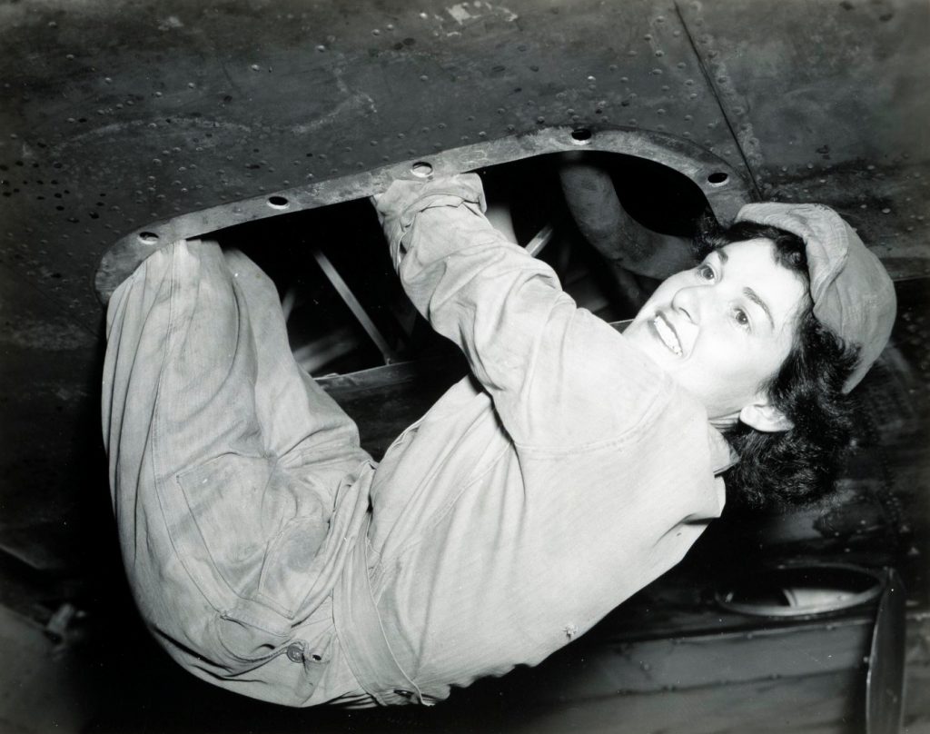 WAC Aircraft Mechanic Hanging From B-17 Wing – Women of World War II